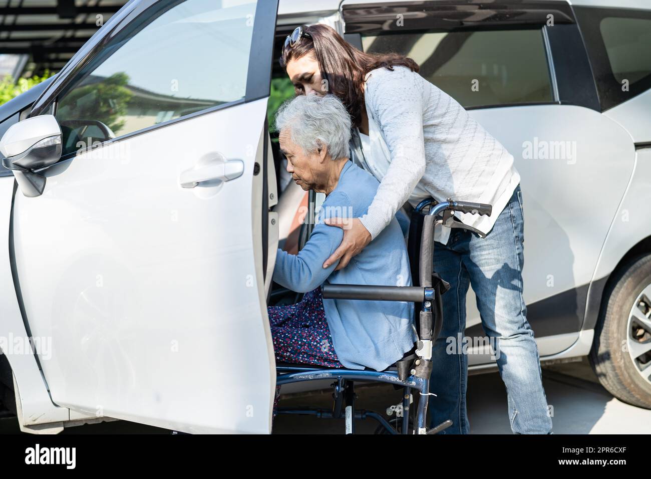 Asian senior or elderly old lady woman patient sitting on wheelchair ...