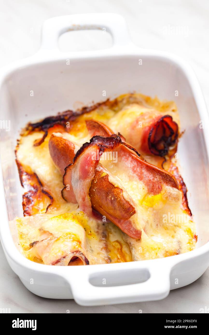 wurst in bacon baked with chedar cheese Stock Photo - Alamy
