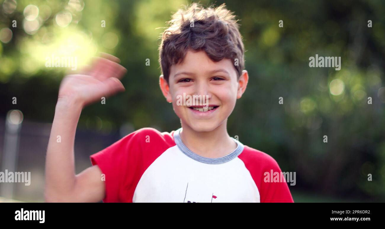 Happy child boy smiling waving hello to camera. Joyful kid face ...