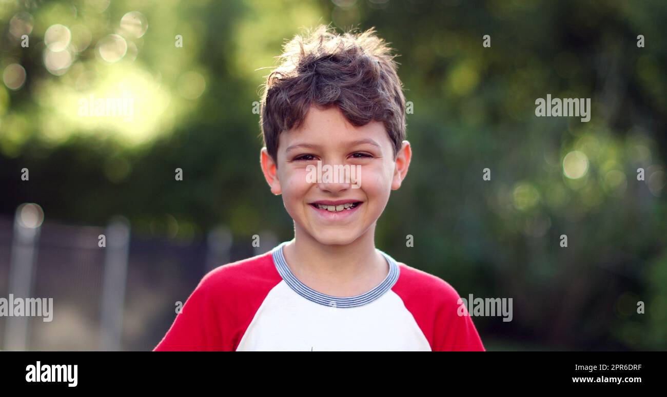 Happy child boy smiling waving hello to camera. Joyful kid face ...