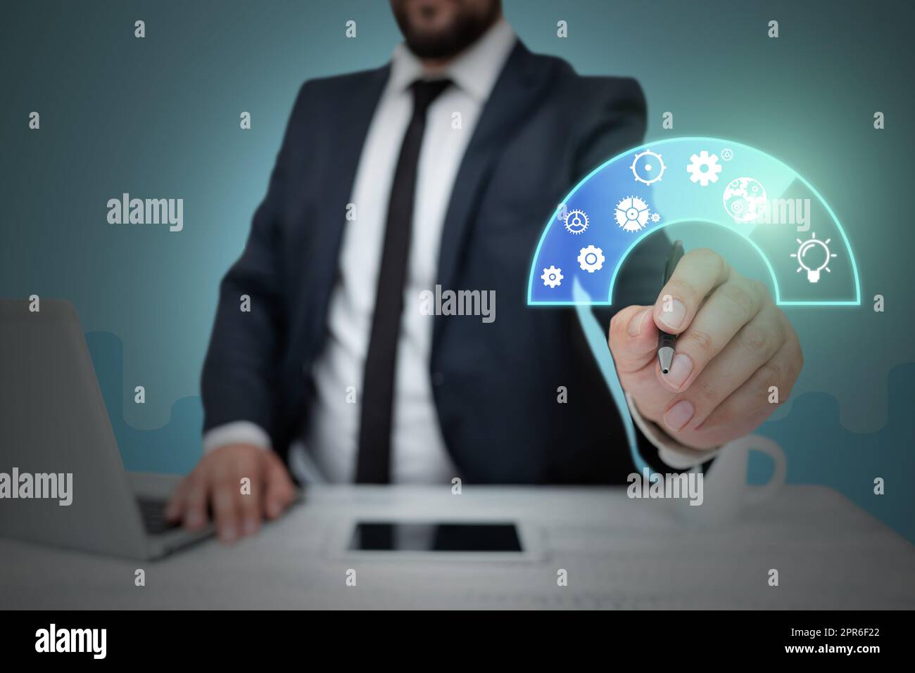 Businessman in suit holding pen representing innovative thinking ...