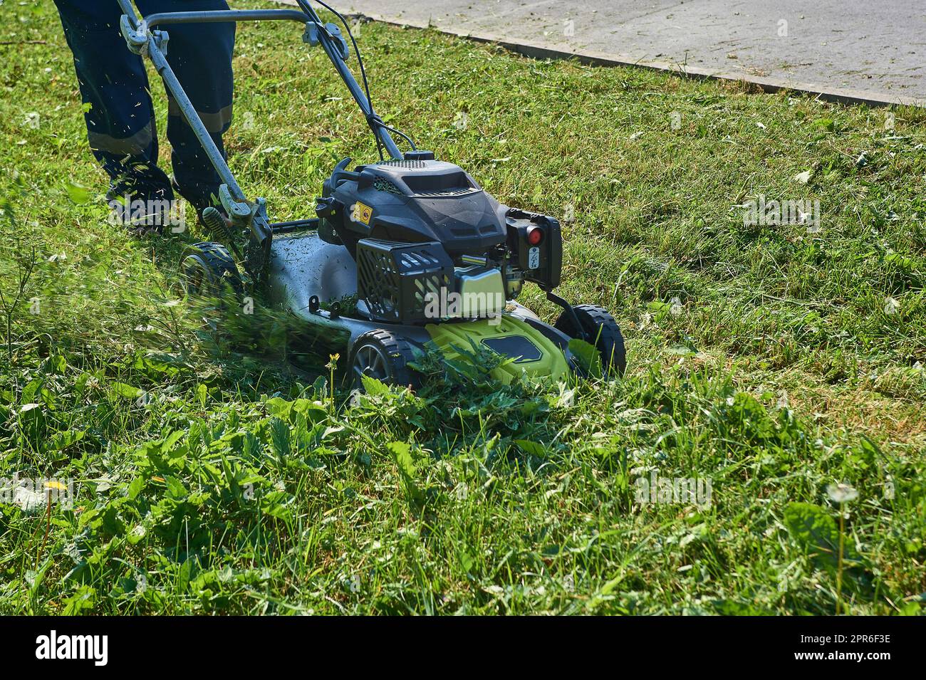 Person mowing lawn mower hi-res stock photography and images - Alamy