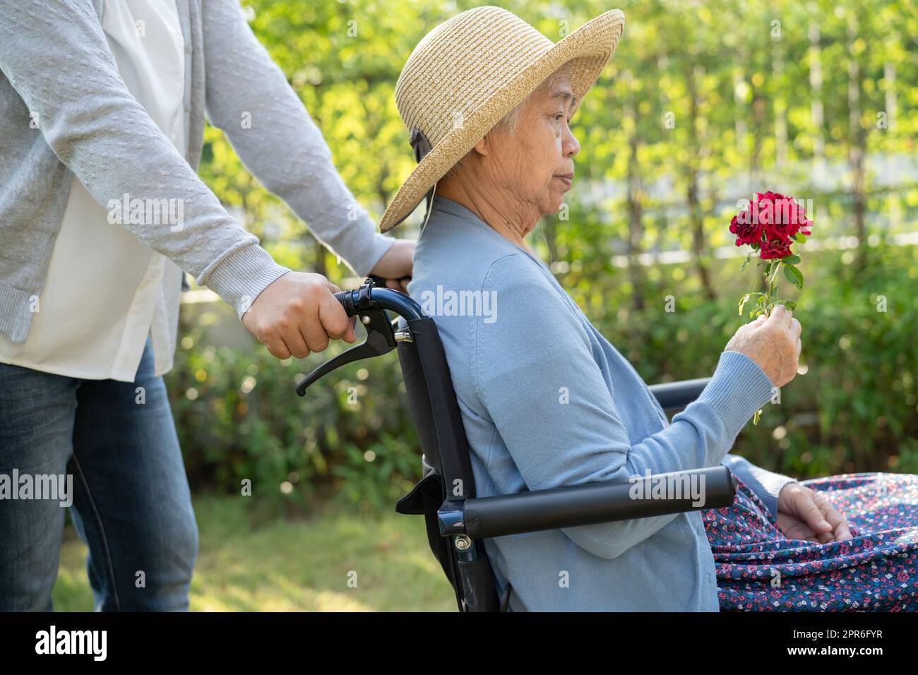 Caregiver daughter hug and help Asian senior or elderly old lady woman ...