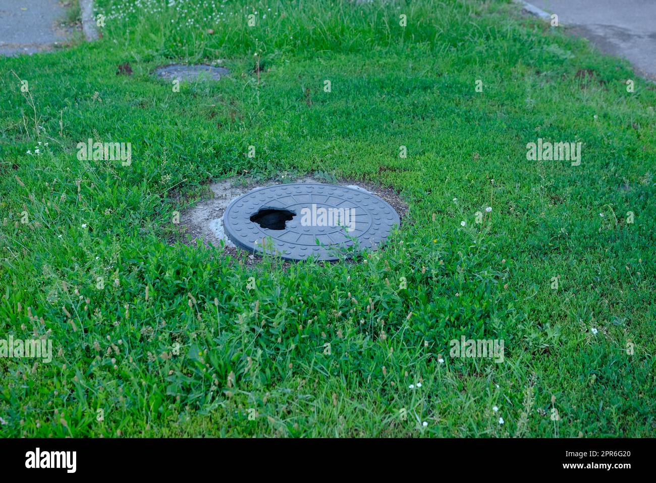 Open manhole grass hi-res stock photography and images - Alamy