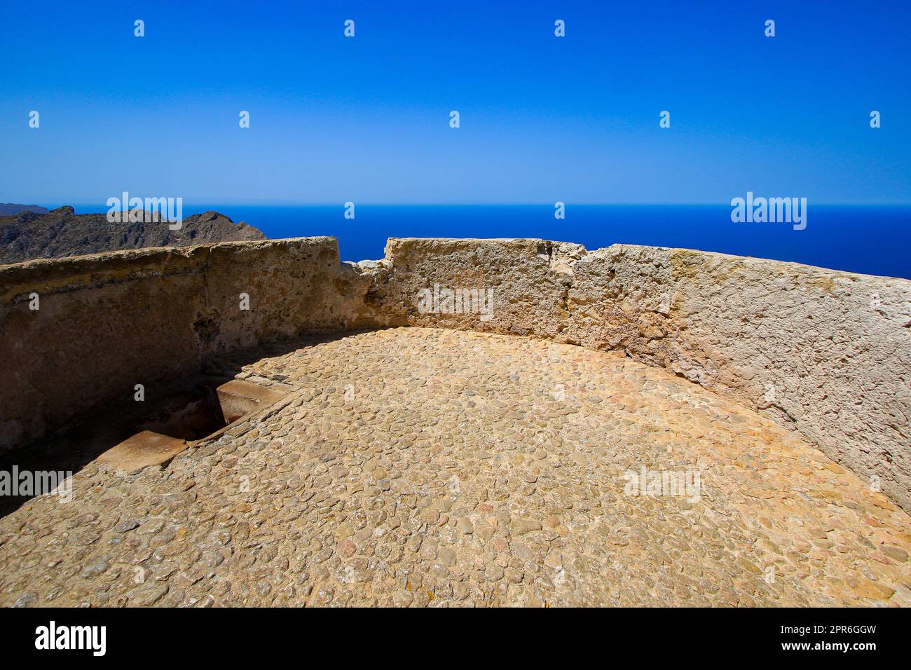 Rooftop terrace of the Albercutx watchtower, an ancient round stone ...
