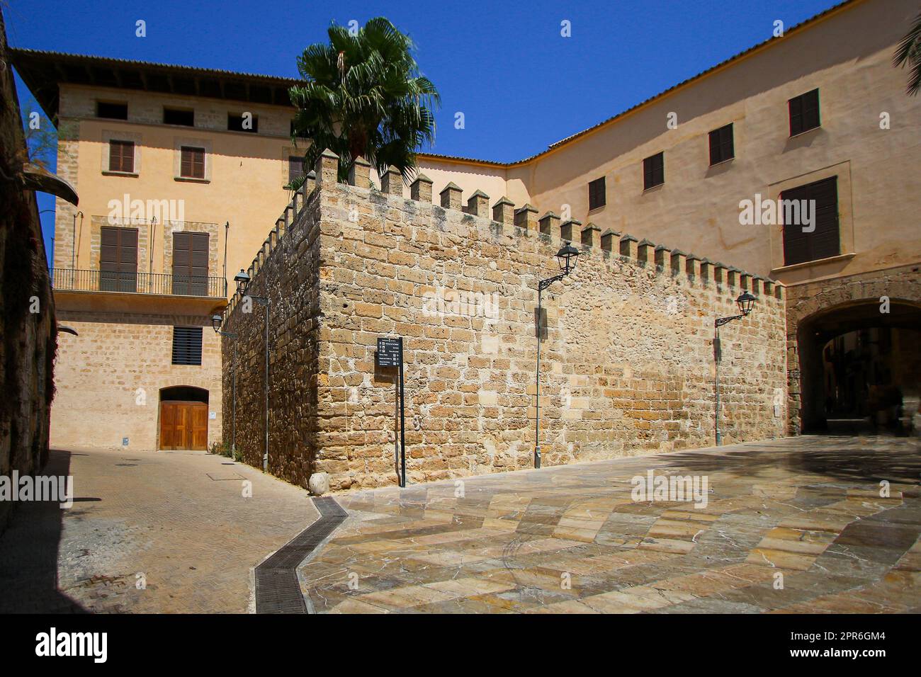 Stone wall in the courtyard of the Arab baths of Palma of Mallorca ...