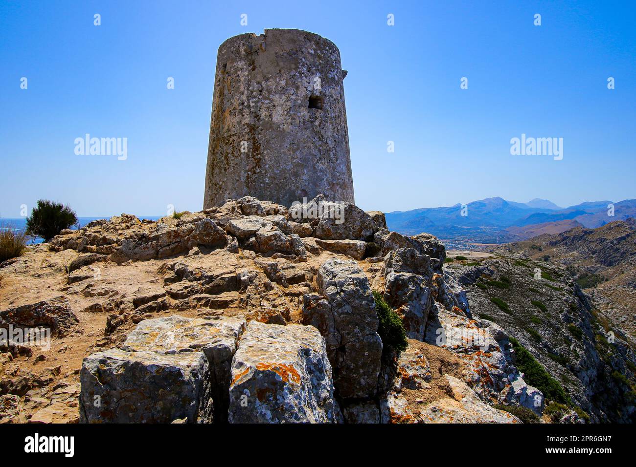 Albercutx watchtower is an ancient round stone fort built at the top of ...
