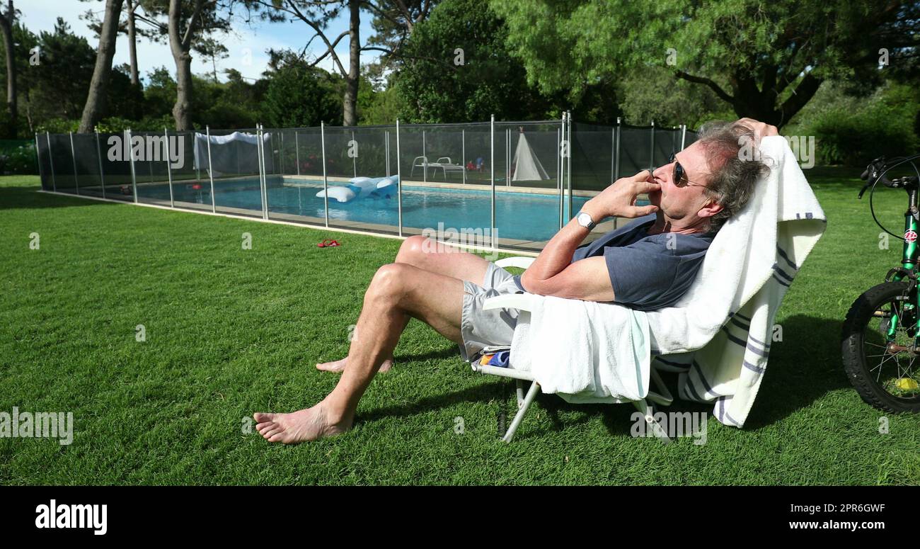 Older retired man resting outside Stock Photo - Alamy