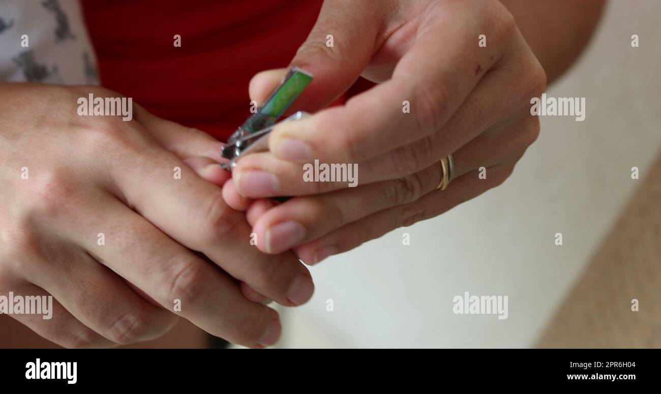 Parent trimming baby nails. Mother cutting crying infant nail Stock ...