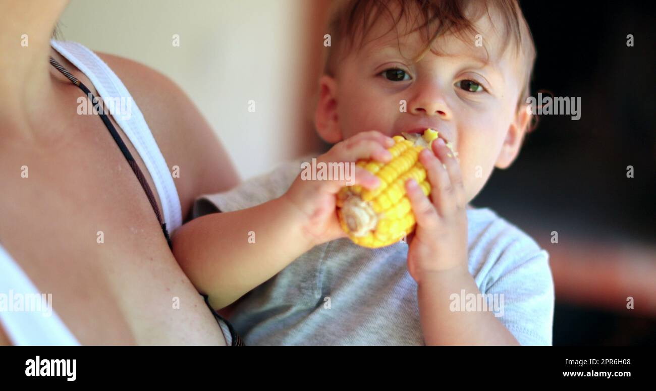 Cute kid eating corn hi-res stock photography and images - Alamy