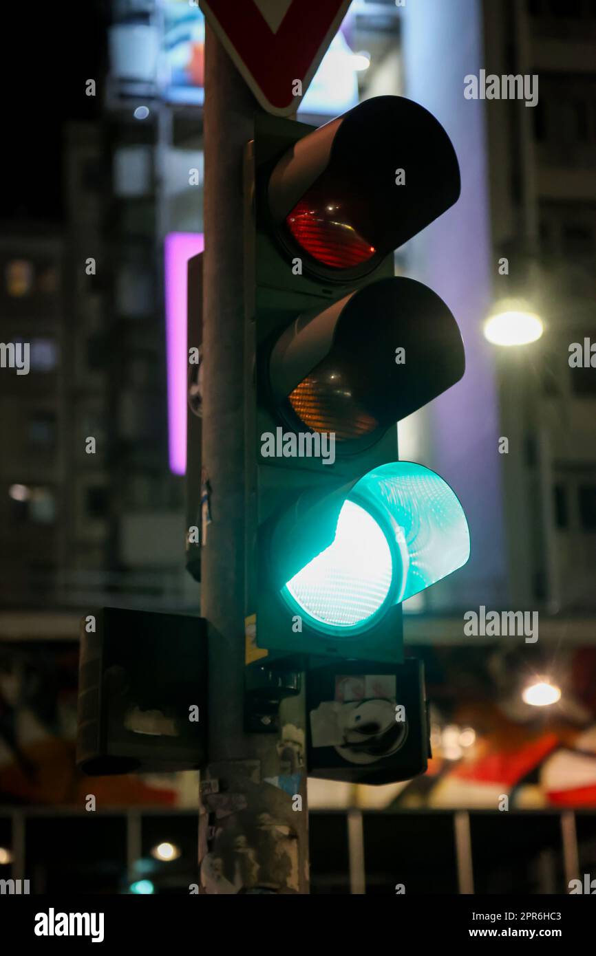A traffic light system at a road intersection in operation Stock Photo ...