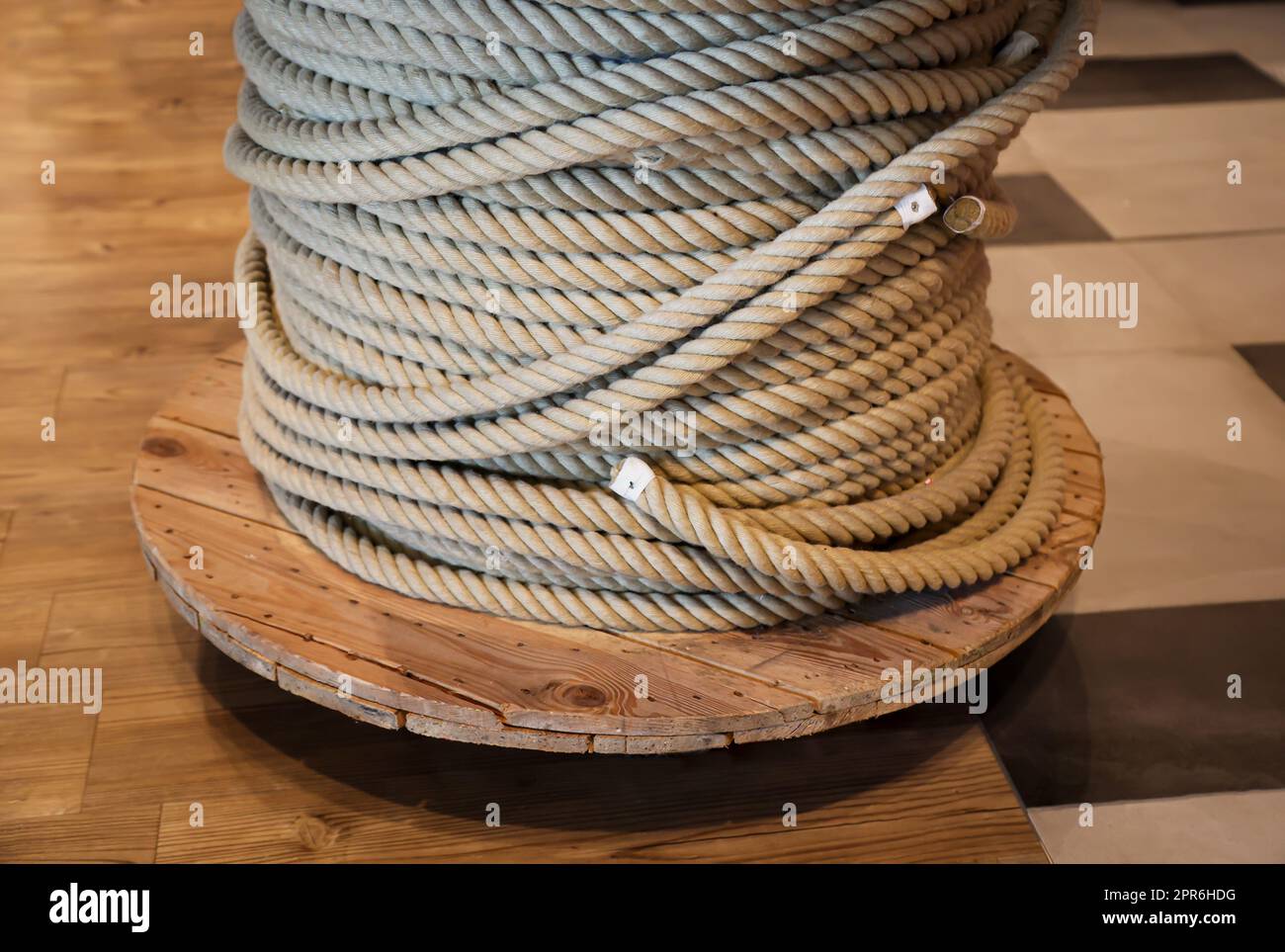 A drum with a coiled, wound rope, a rope Stock Photo - Alamy