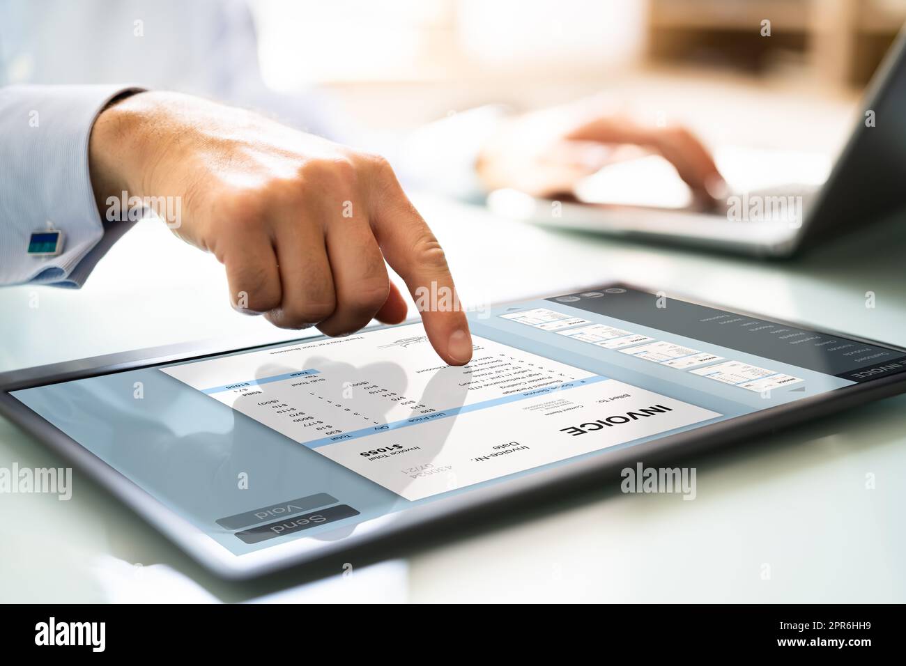 Accountant Checking E Invoice On Tablet Stock Photo - Alamy
