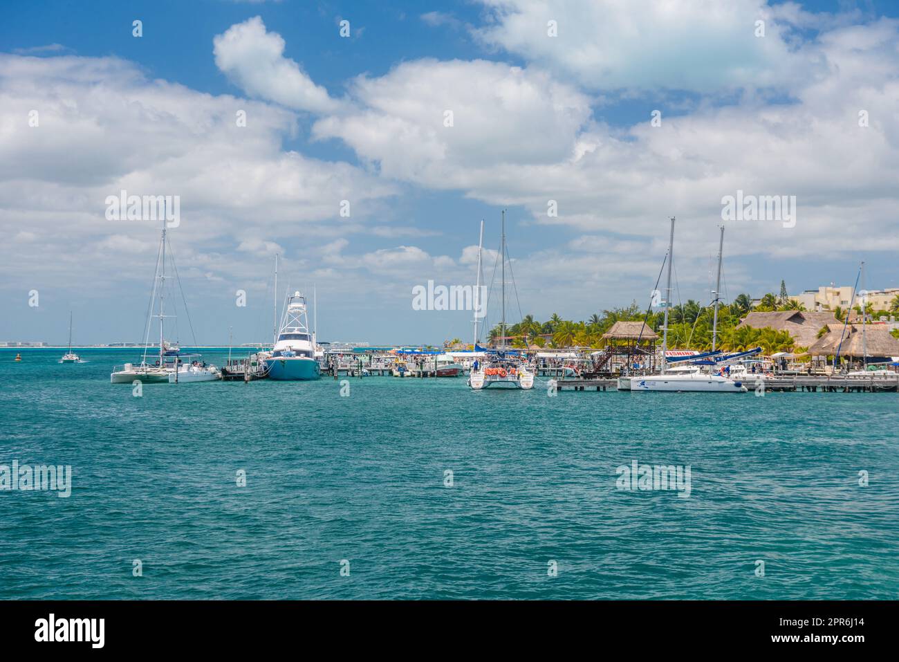 Port with sailboats and ships in Isla Mujeres island in Caribbean Sea ...