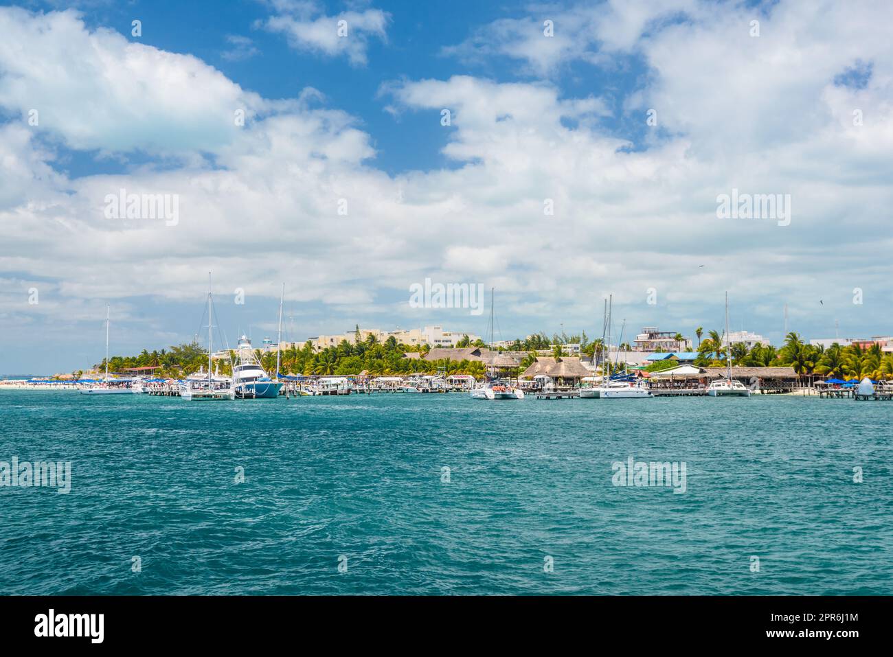 Port with sailboats and ships in Isla Mujeres island in Caribbean Sea ...