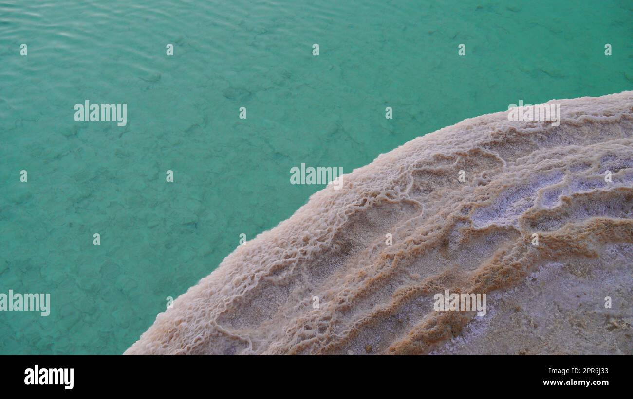 Large Salt accumulated on the shore of the Dead sea. Deposits of mineral salts, typical ...