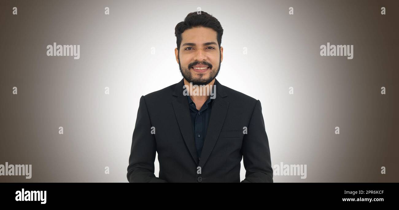Portrait of young businessman with moustache and beard in black suit on ...