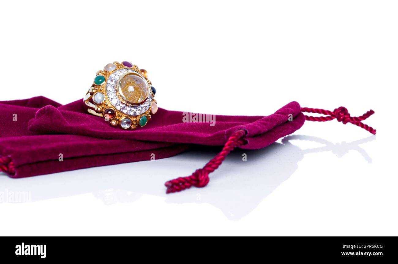 Golden Rutilated Quartz and diamonds with nine gemstones ring on red ...