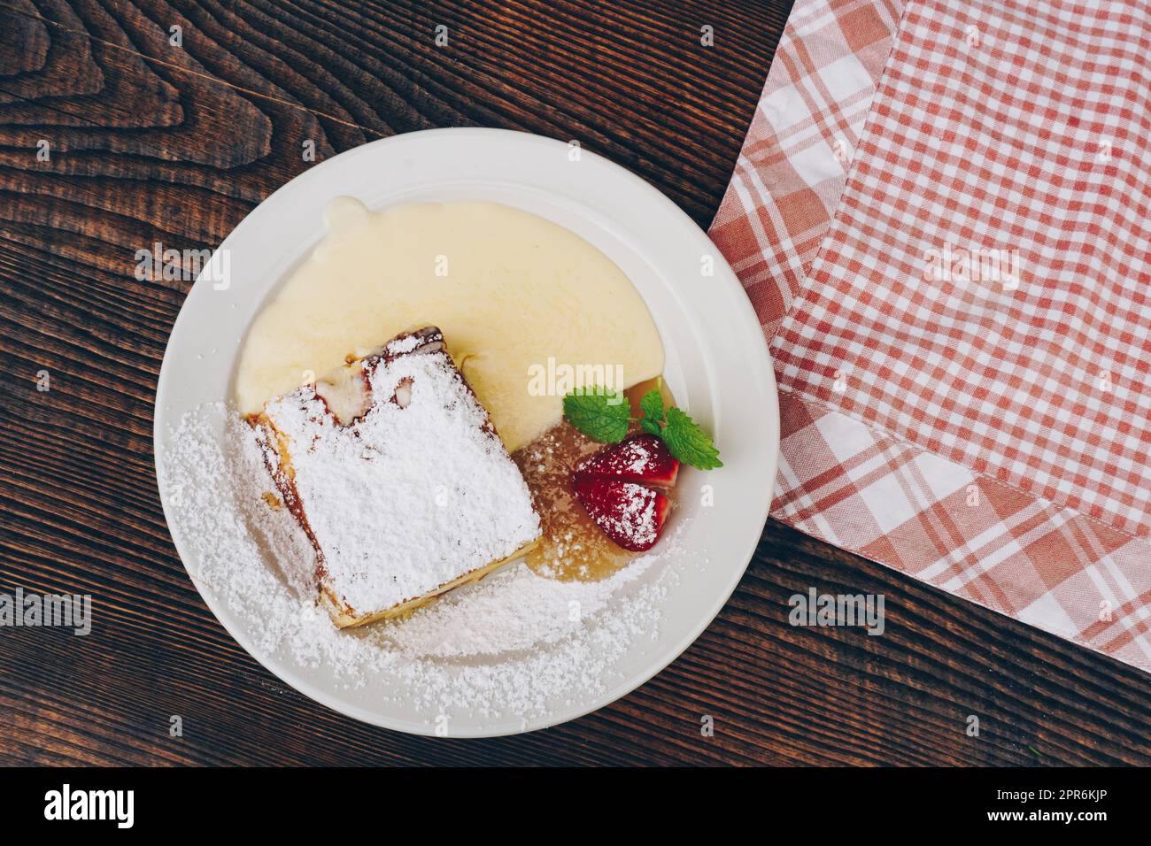 Curd strudel with vanilla sauce Stock Photo - Alamy