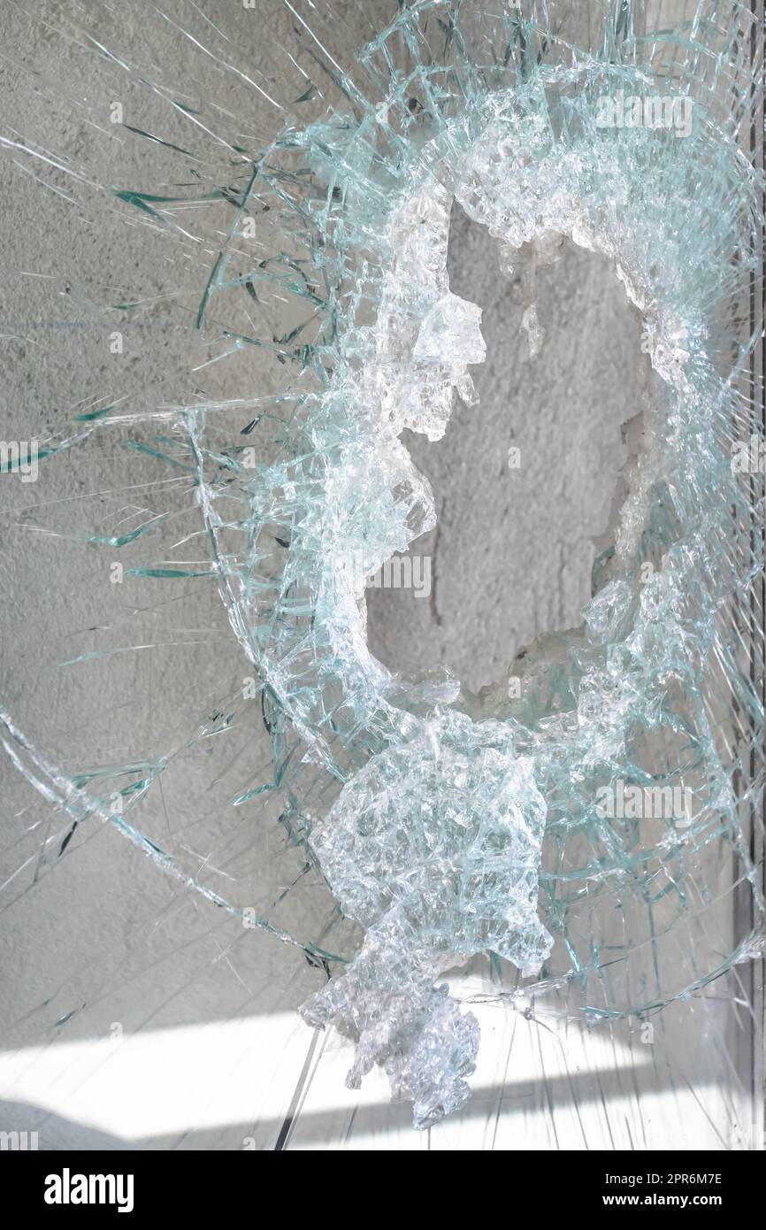 Broken bullet windshield glass hole damage hi-res stock photography and ...