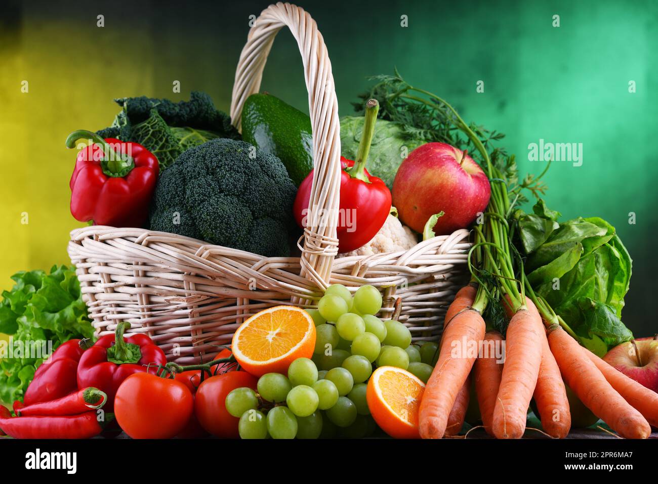Fresh organic fruits and vegetables in wicker basket Stock Photo - Alamy