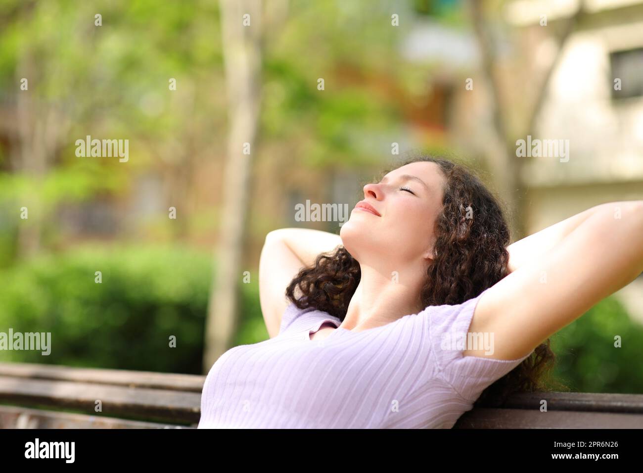 Woman resting head on arms hi-res stock photography and images - Alamy