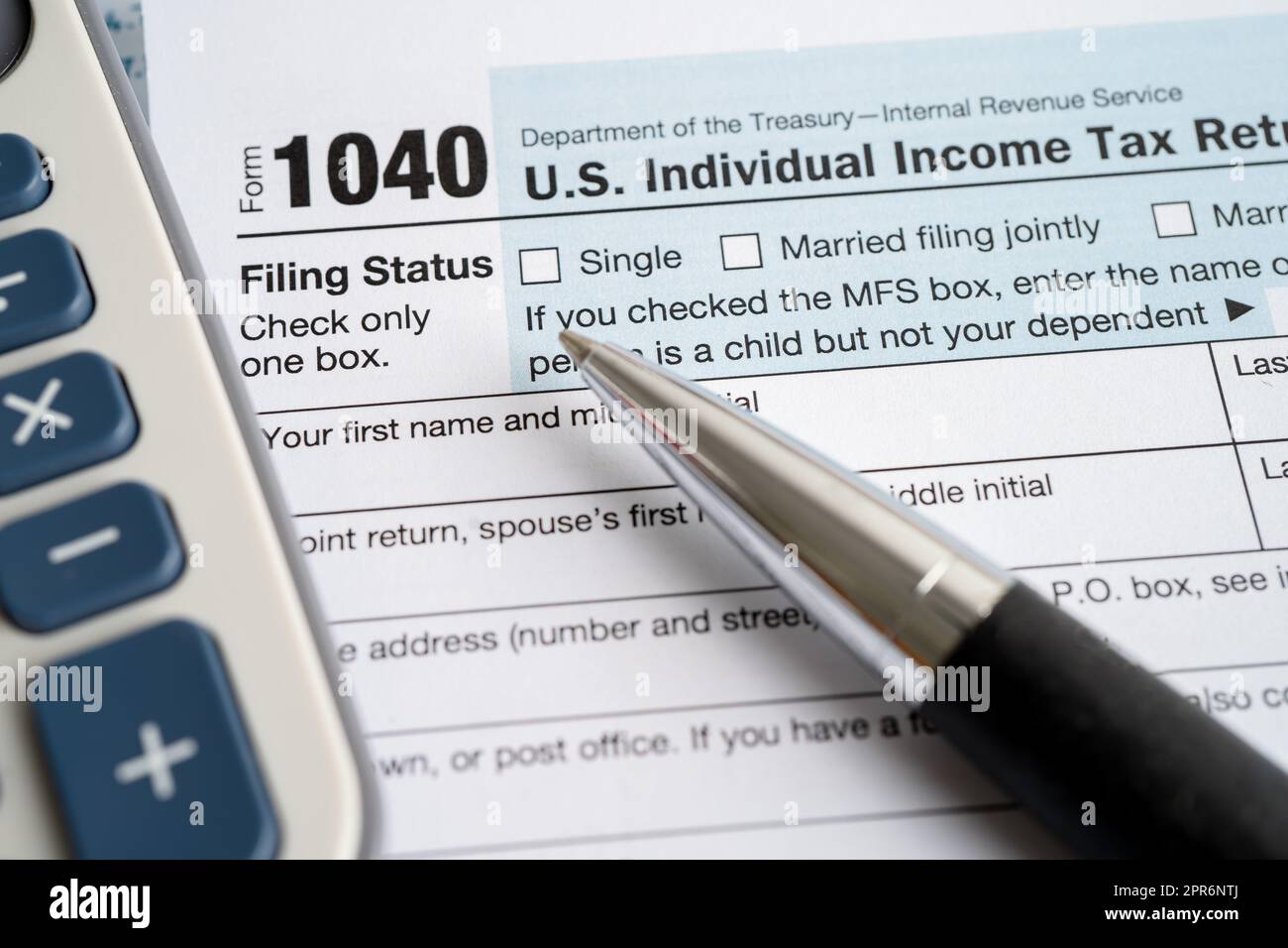 Tax Return form 1040 with USA America flag and dollar banknote, U.S ...