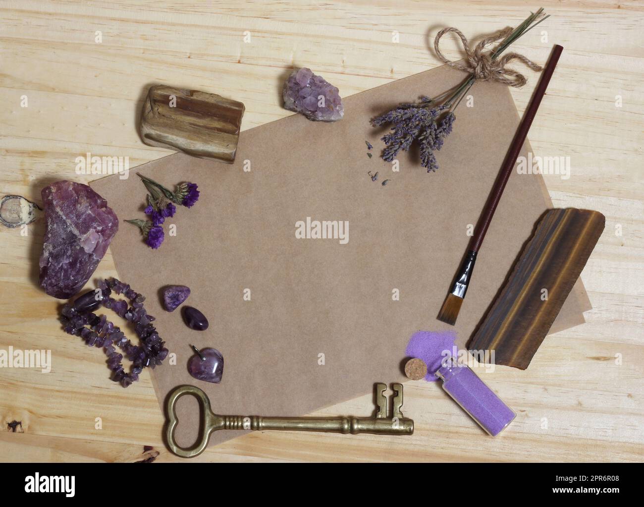 Amethyst Stones With Petrified Wood on Old Paper With Dried Flowers and ...