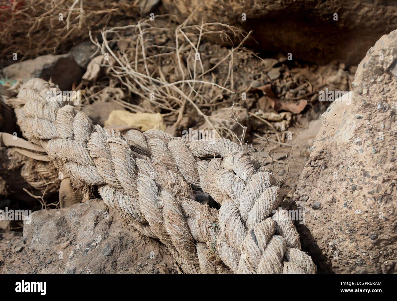 A carelessly thrown away old rope from a cutter, ship Stock Photo - Alamy