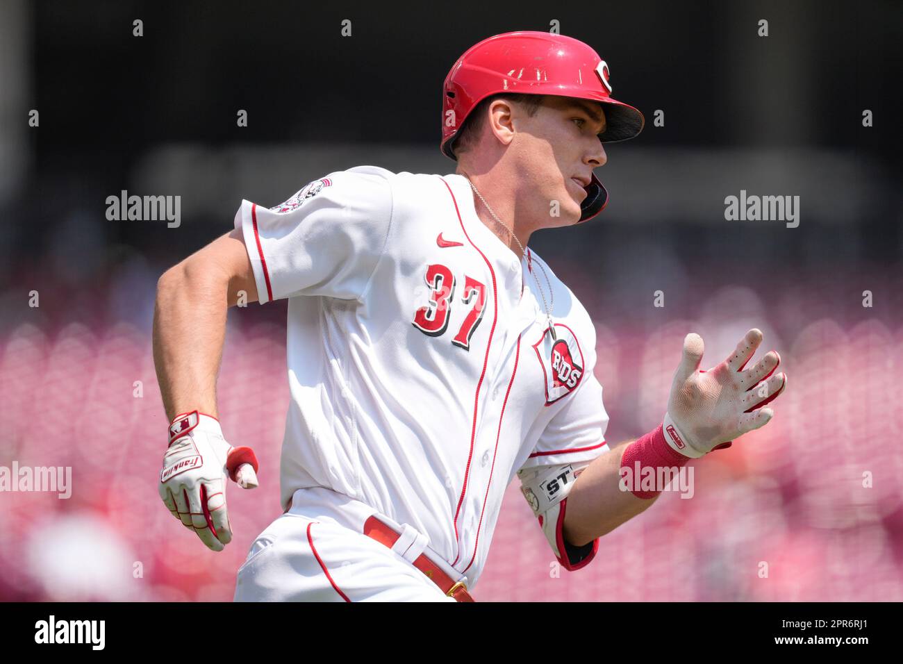 Cincinnati Reds' Tyler Stephenson (37) rounds first base after hitting ...