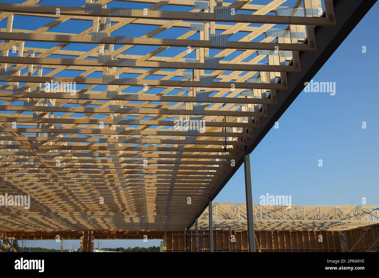 building under construction wood roof structure beams planks house ...