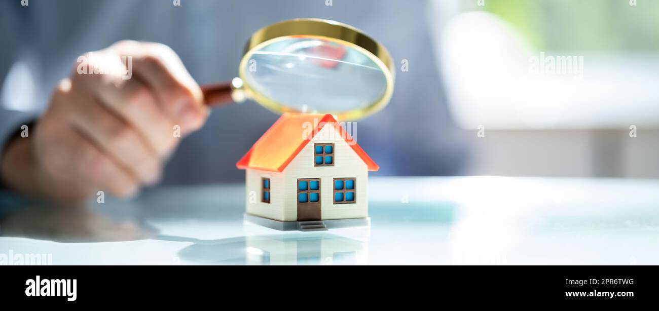 Businessperson looking house model hi-res stock photography and images ...