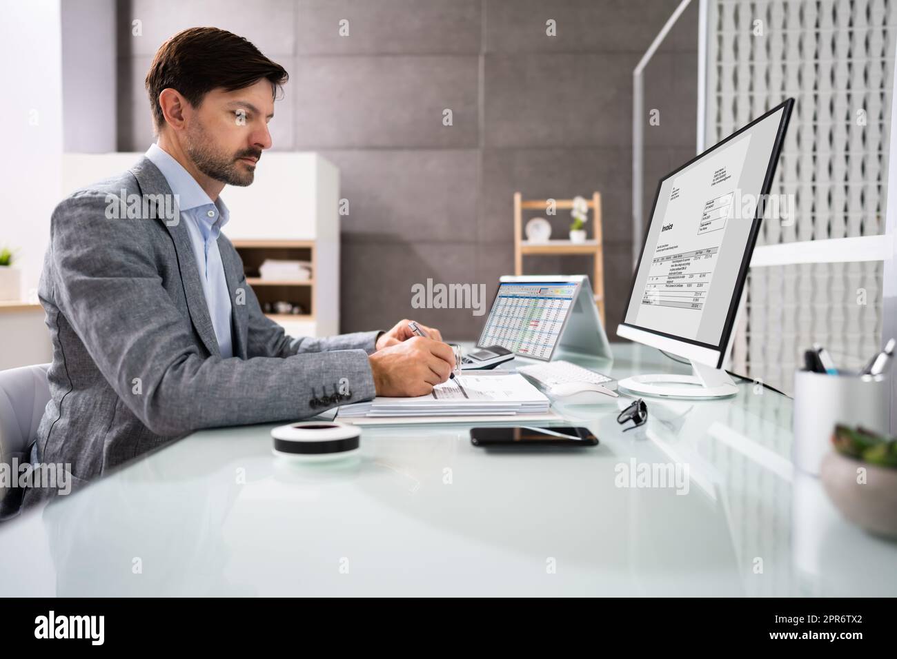 Accountant man sitting in hi-res stock photography and images - Alamy