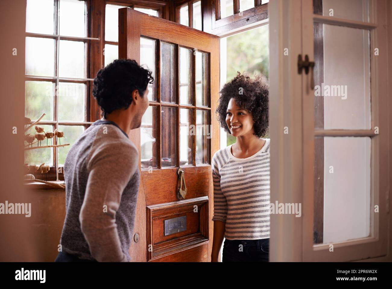 Greeting at the door hi-res stock photography and images - Alamy