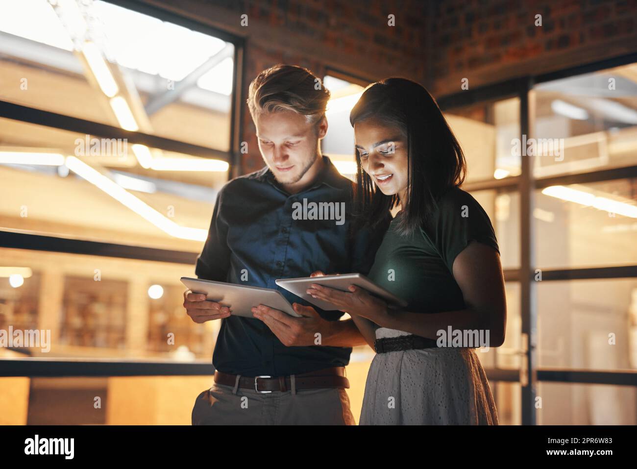 We commit ourselves to beating every deadline. Shot of two designers ...