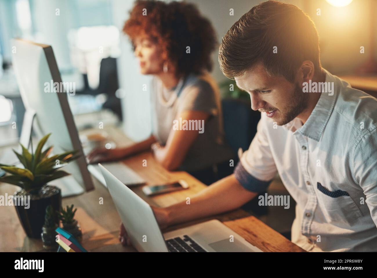 Go the extra mile, its never crowded. Shot of a young designer working ...