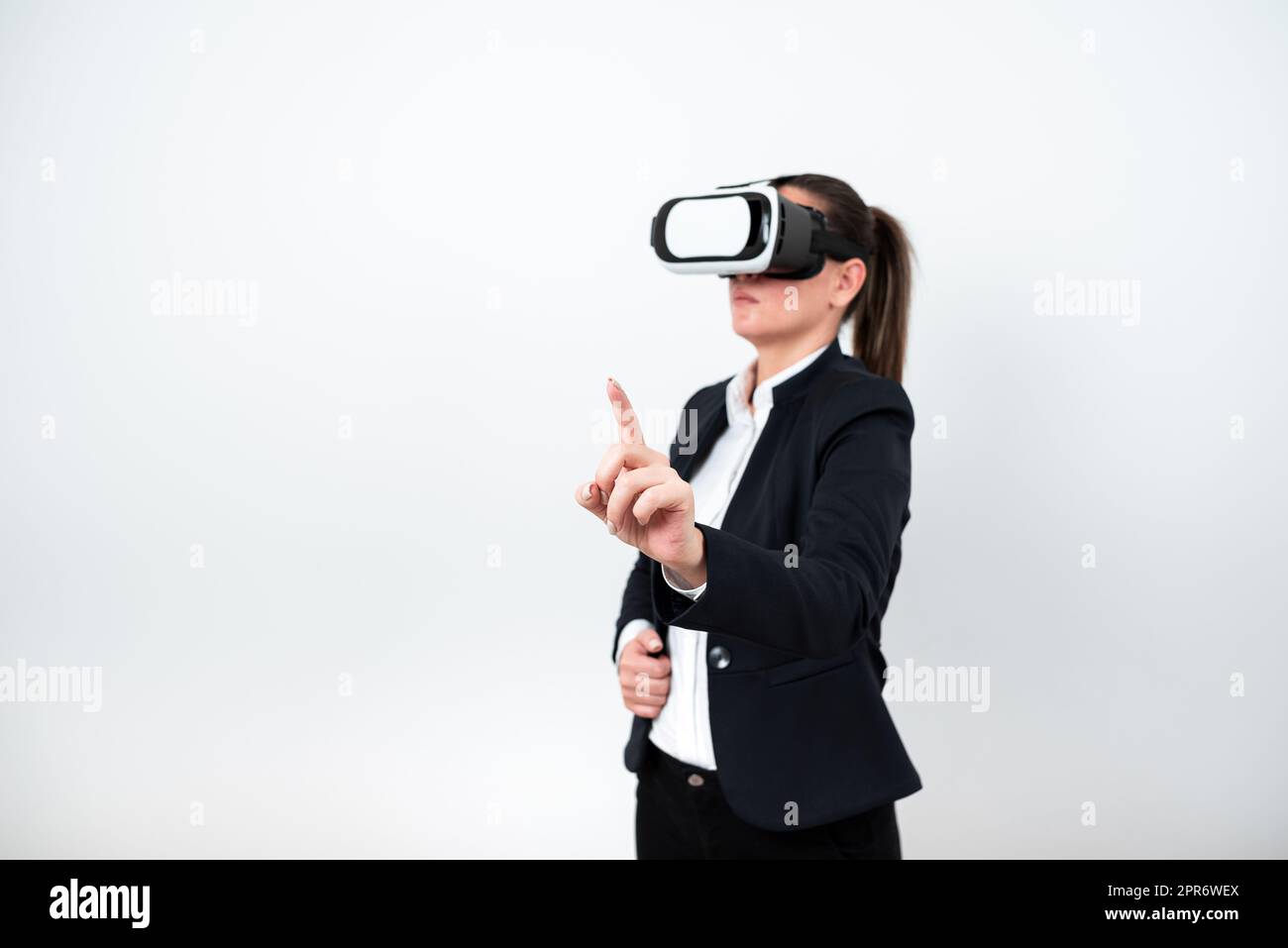 Woman Wearing Vr Glasses And Pointing On Important Messages With One ...