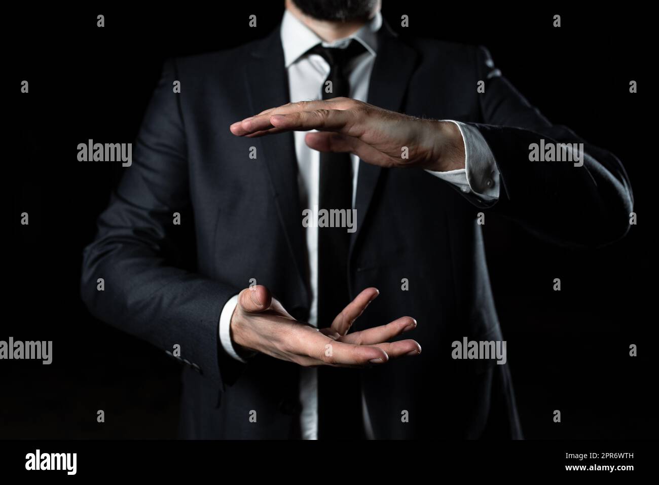 Businessman Holding Important Message Between Hands. Man In Suit ...