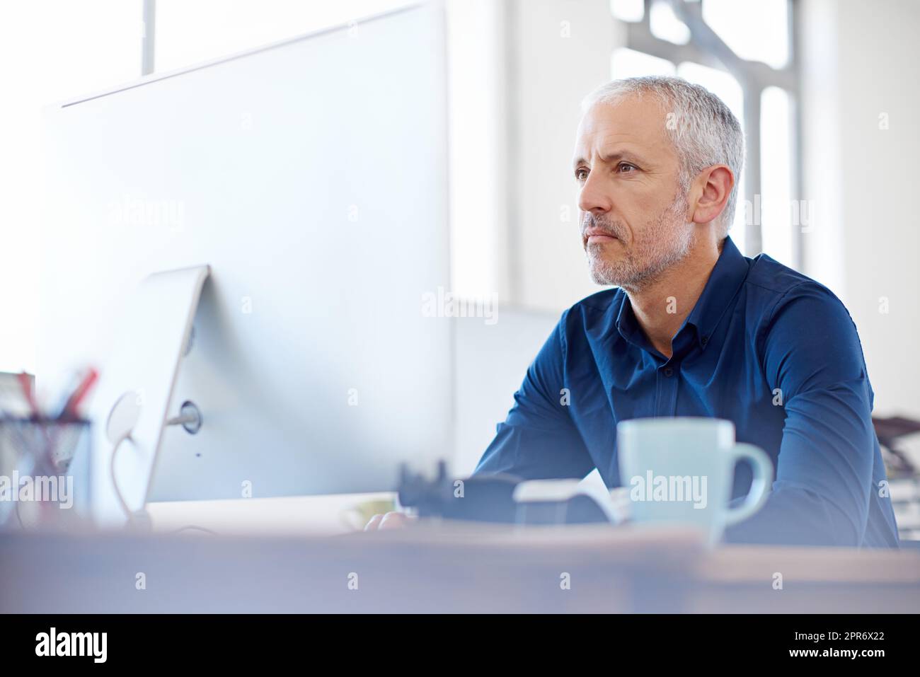 Person working on computer behind hi-res stock photography and images ...