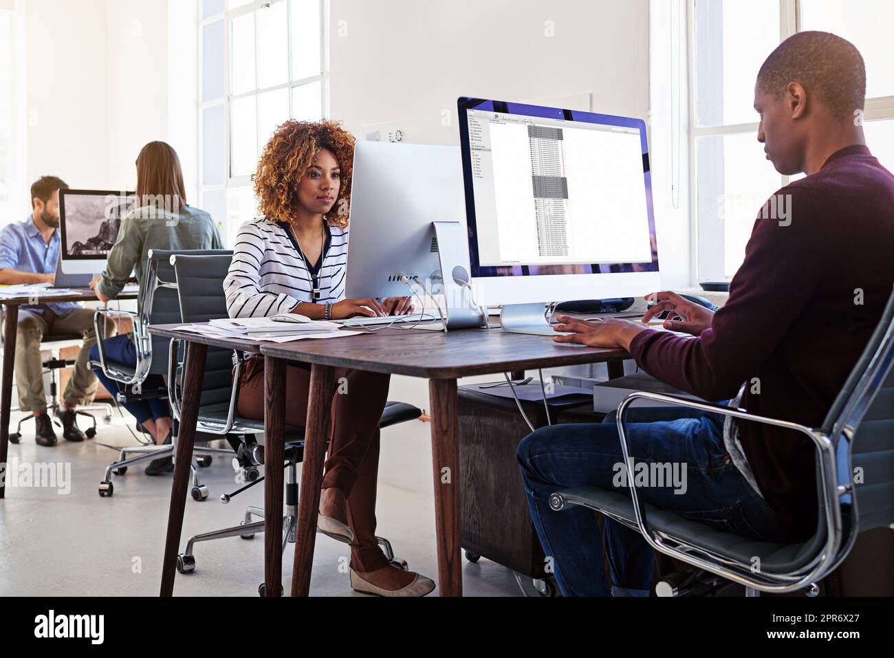 Its all about productivity in their office. Shot of colleagues working ...