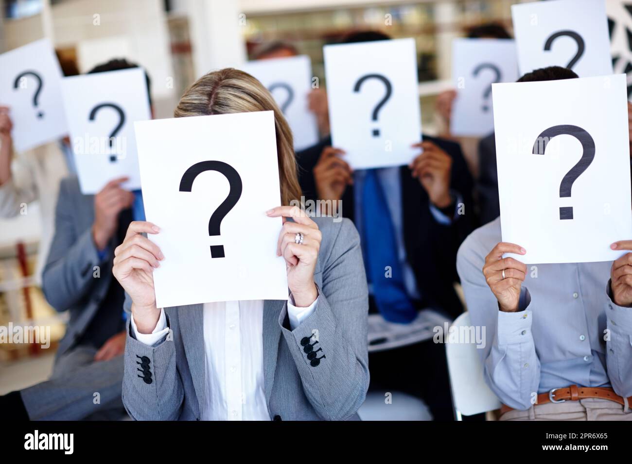 Business team holding question marks hi-res stock photography and ...