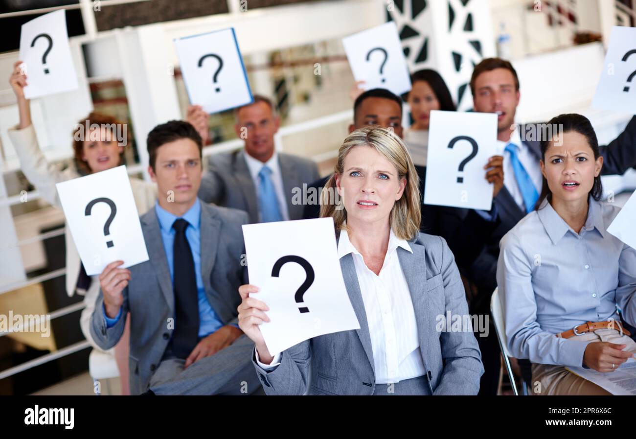 Business team holding question marks hi-res stock photography and ...