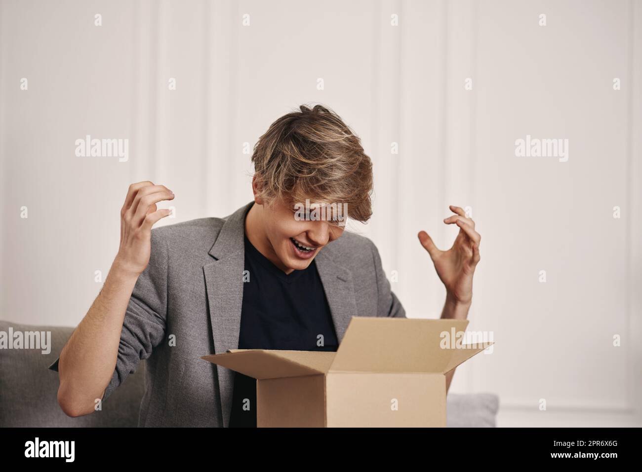 Man sitting couch hi-res stock photography and images - Alamy