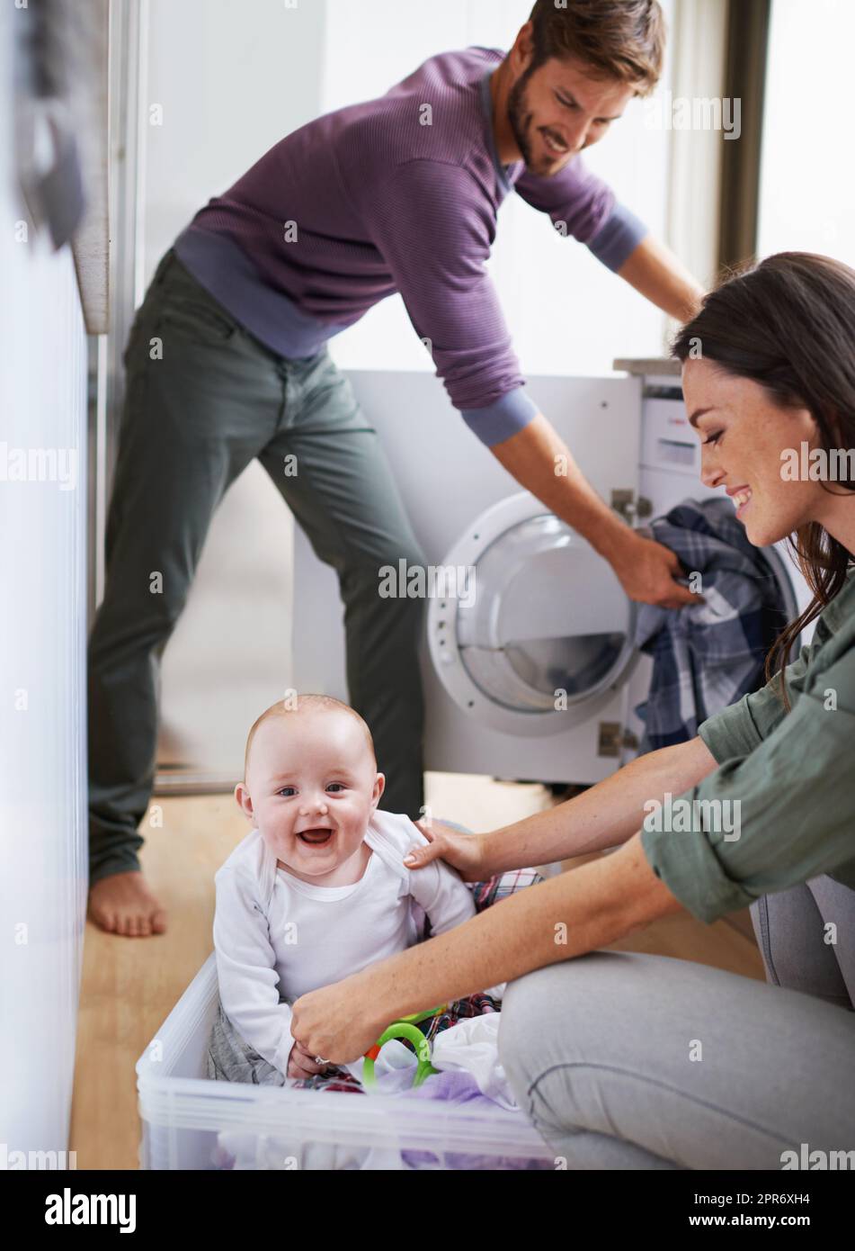 How did you get in here. Shot of a young family having fun while doing ...