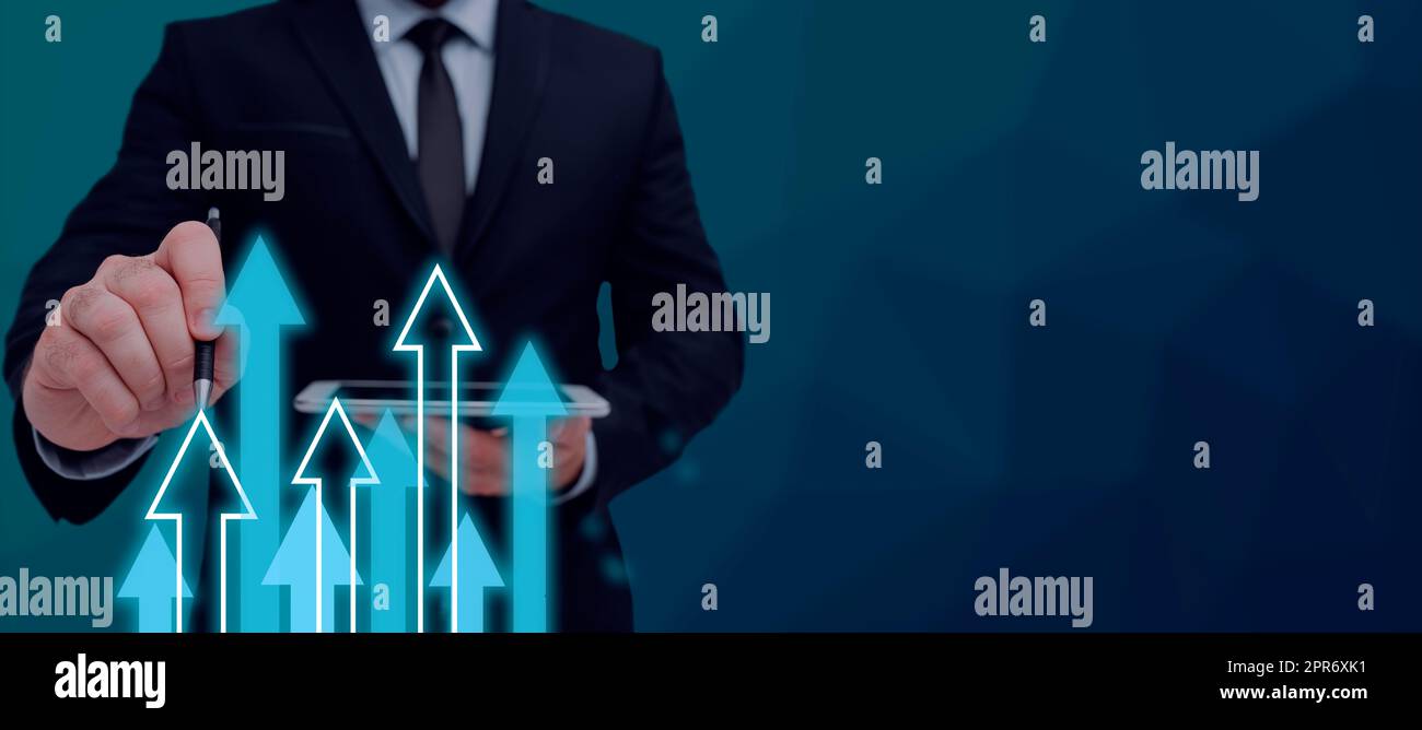 Businessman Holding Tablet And Pen Which Points On Arrows Up And ...
