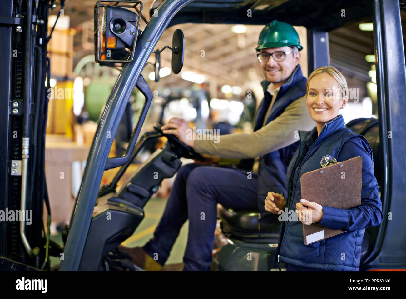 Off to do stock take. Cropped shot of a two coworkers managing a ...