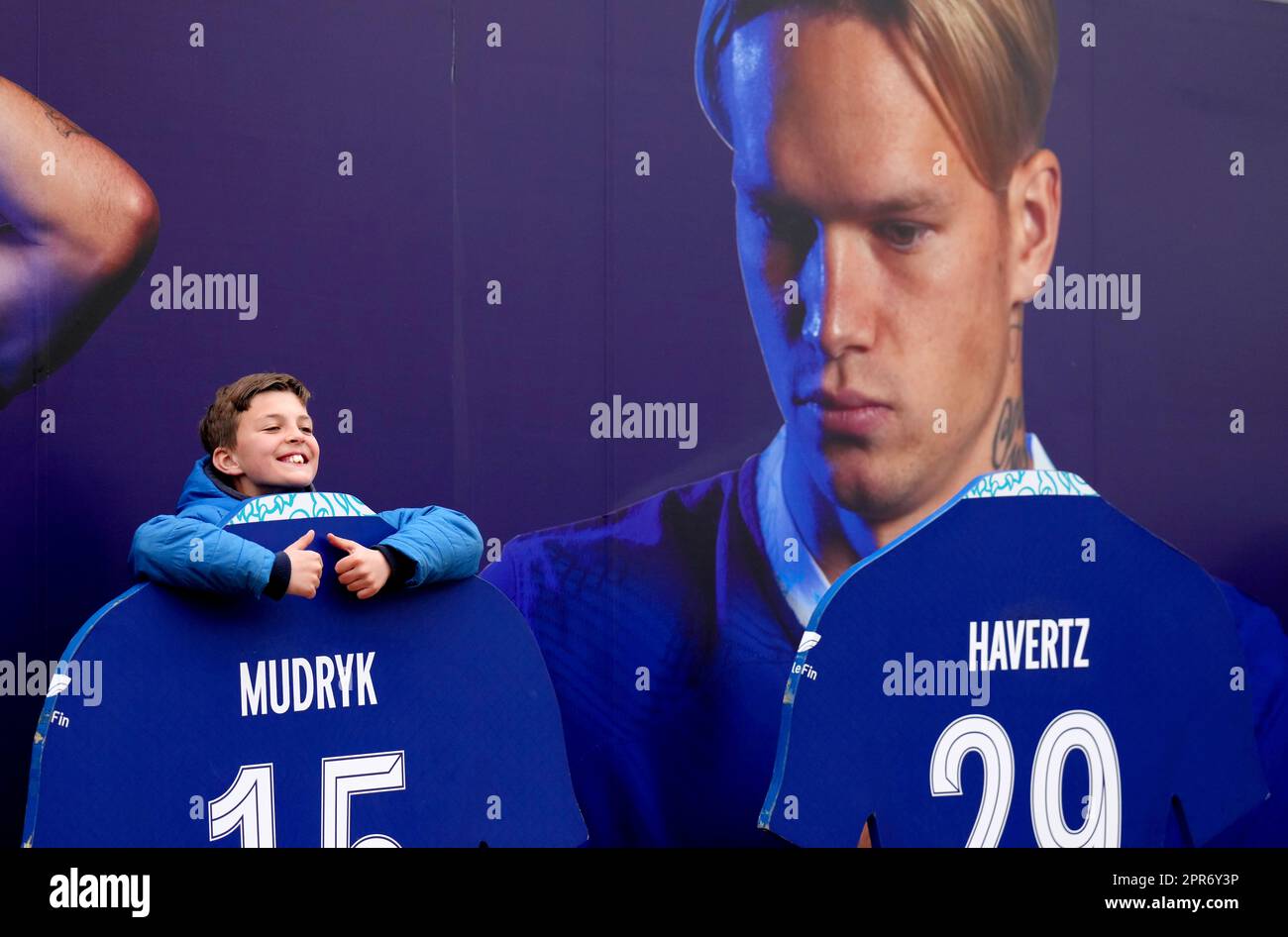 A Chelsea fan poses for a photo ahead of the Premier League match at ...