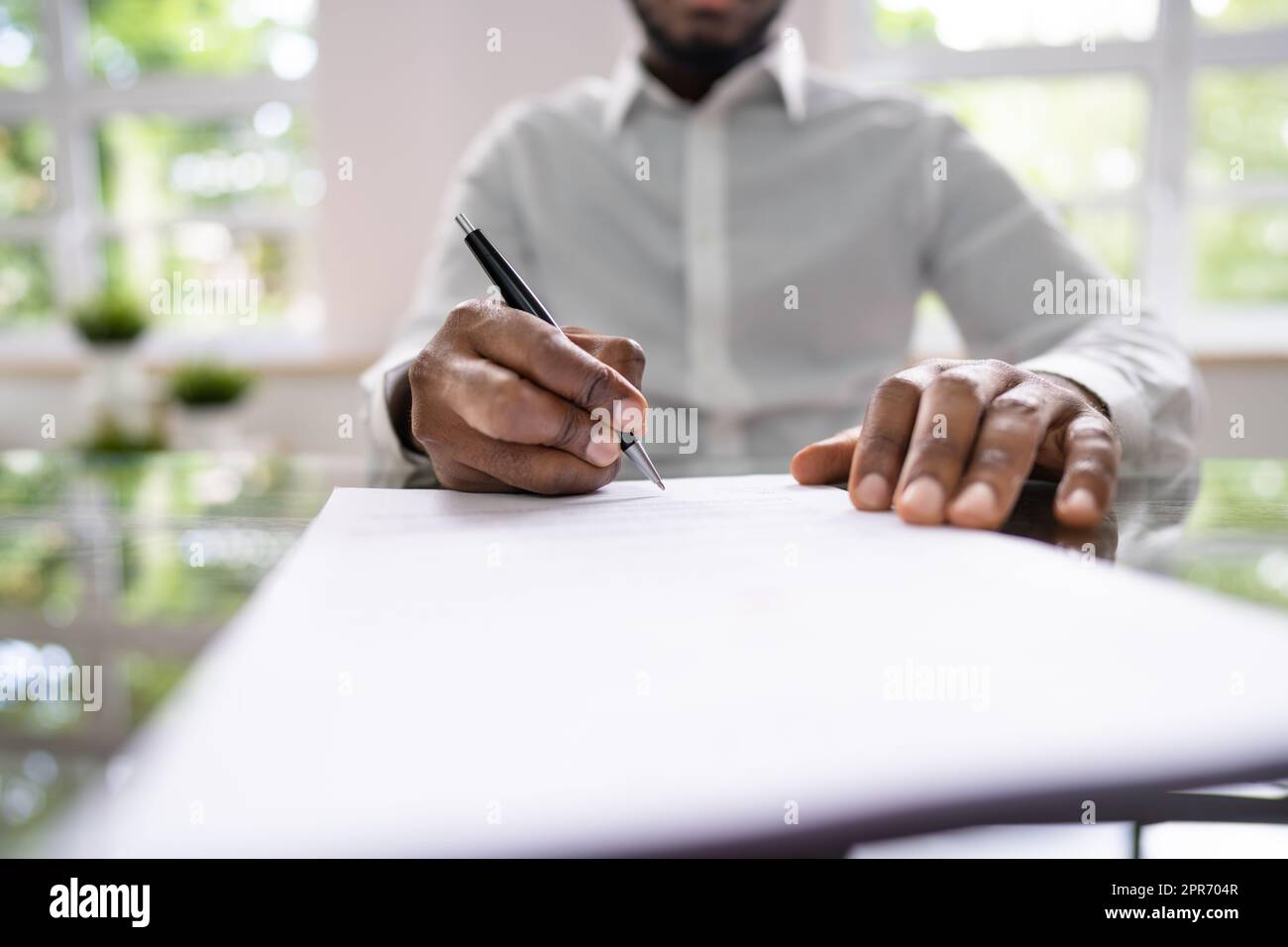 Agreement Form Signature. Hand Signing Paper Stock Photo - Alamy