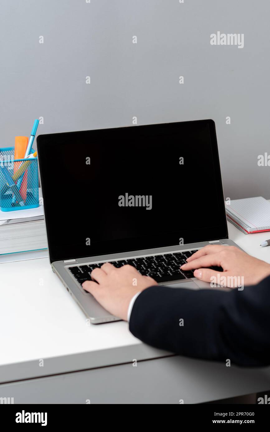 Businesswoman Typing Recent Updates On Lap Top Keyboard On Desk. Woman ...