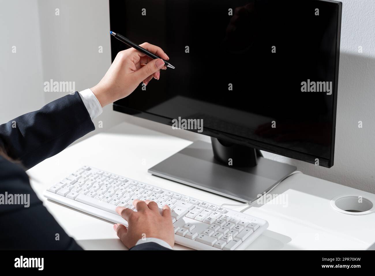 Businesswoman Typing Recent Updates On Lap Top Keyboard On Desk And ...